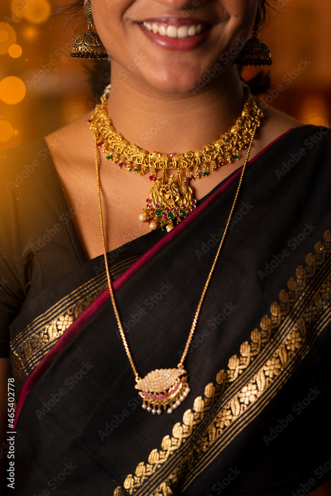 Beautiful gold necklace on neck Stock Photo | Adobe Stock