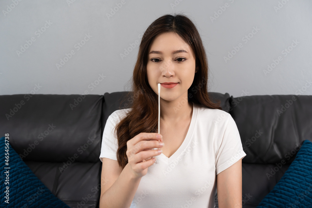 woman using coronavirus(covid-19) rapid antigen self test kit (atk) at ...
