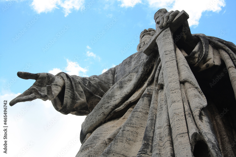 The Apostle Paul with his sword drawn in his hand. Old giant statue in ...