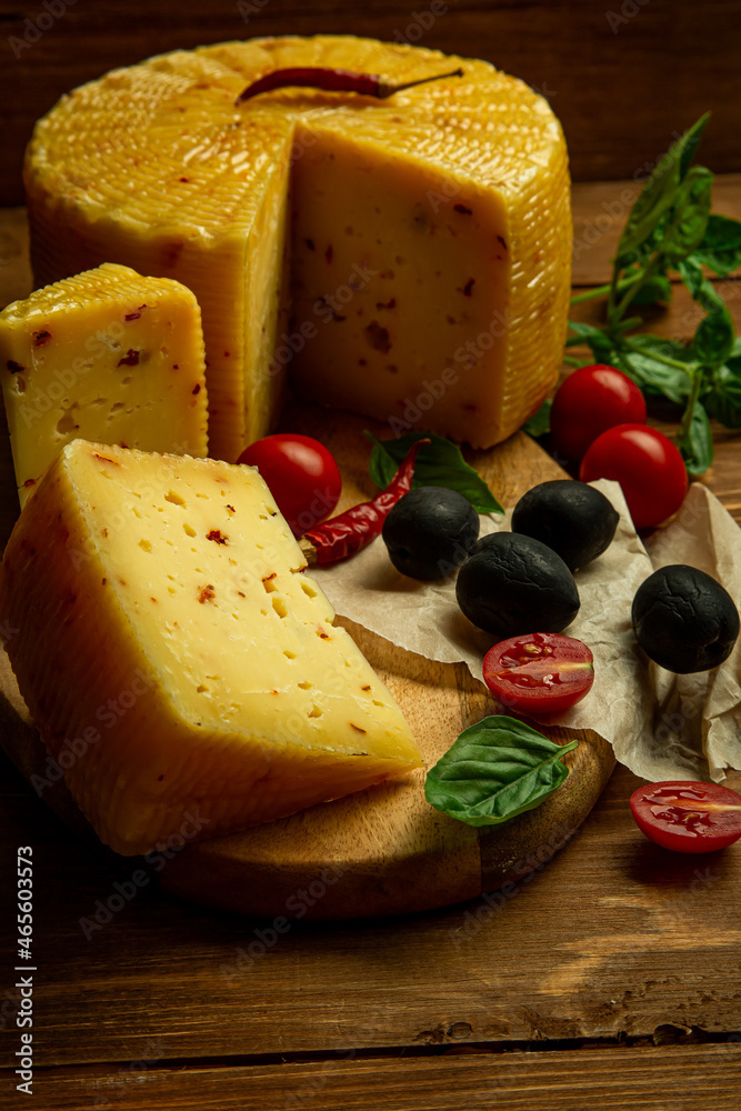 composition of different types of sliced cheese: hard, mature, cheese ...