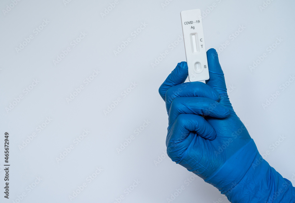 Someone hand holding a rapid antigen test kit before using it. Rapid ...
