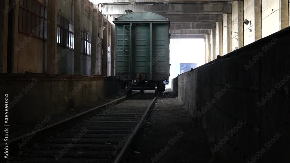 Freight train boxcar with cargo containers at railway dead end storage ...