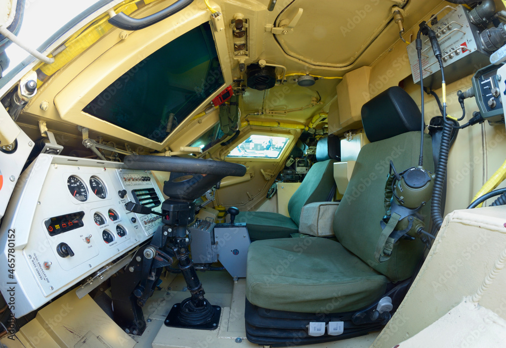 Interior of a new armoured personnel carrier seats, wheel, dashboard ...