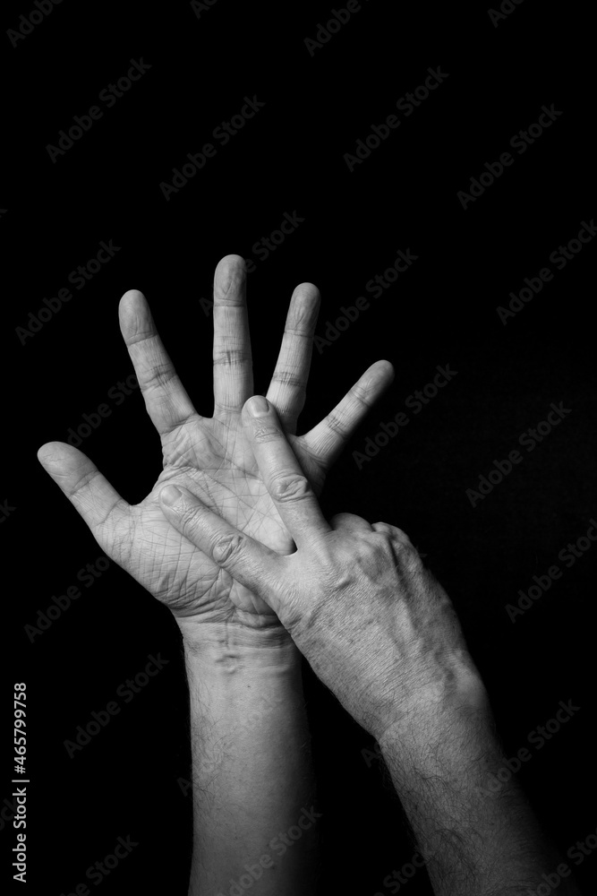 B+W image of hand demonstrating BSL sign language letter V isolated ...