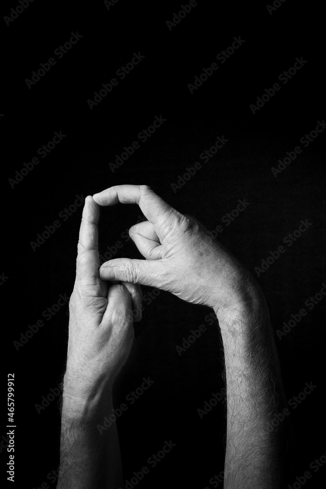 B+W image of hand demonstrating BSL sign language letter D isolated ...