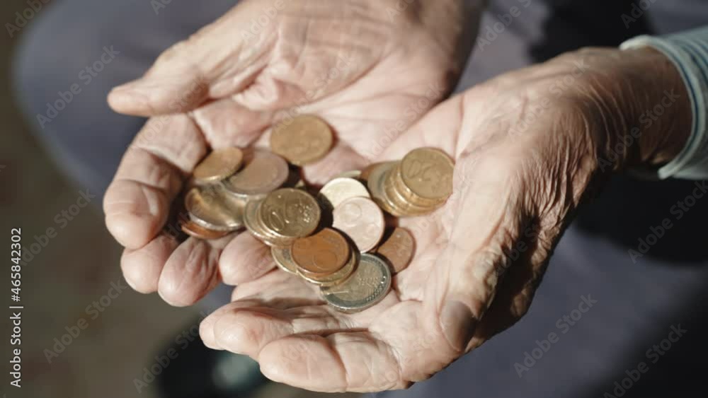 Stack of meager euro coins in hands of old homeless man, abandoned ...