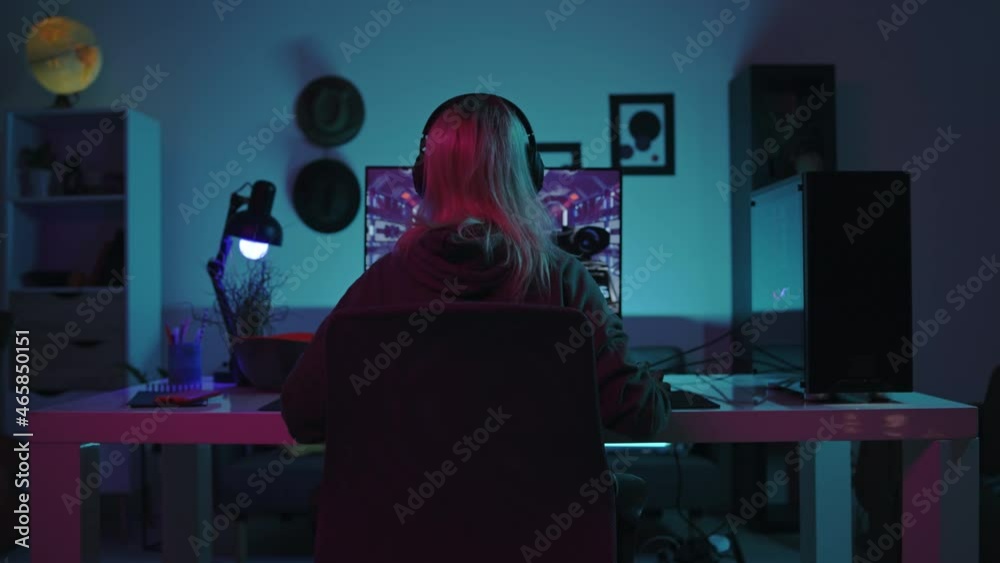 Young Caucasian Girl Gamer Playing Video Games on Her PC Computer, With ...