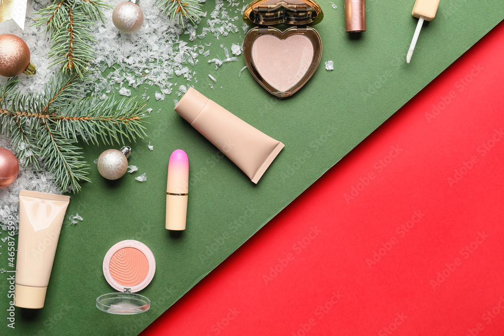 Makeup cosmetics with Christmas decor on green and red background Stock ...