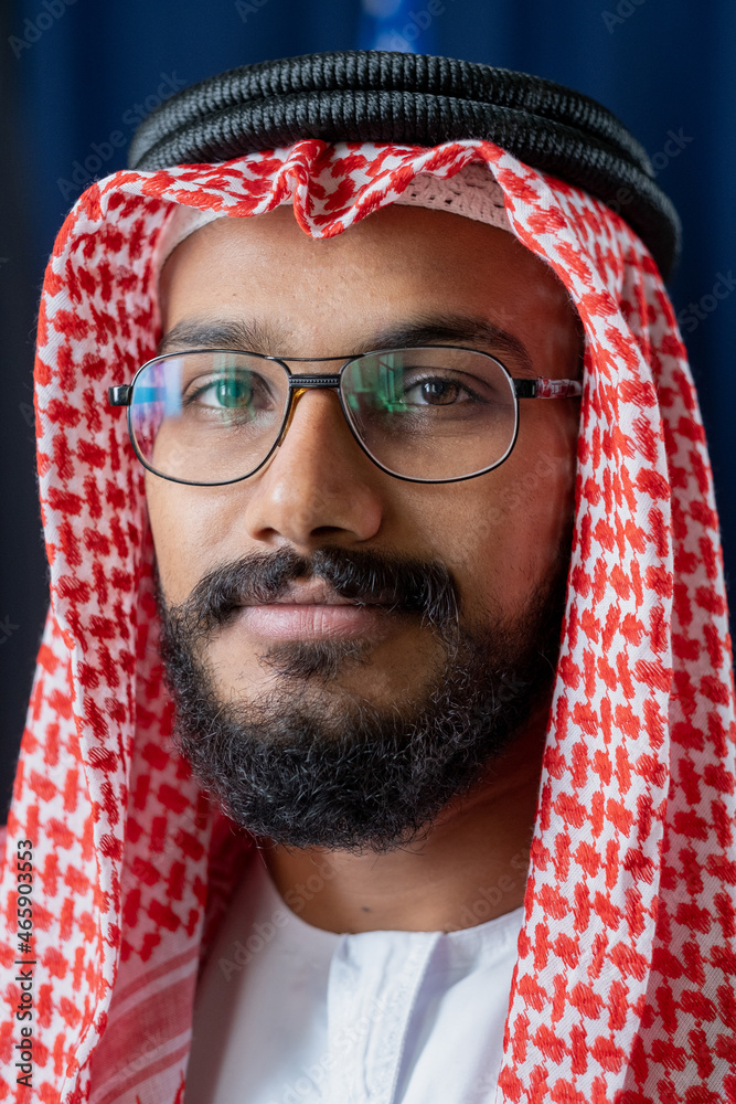 Content Islamic man with beard wearing glasses, agal and ghutrah ...