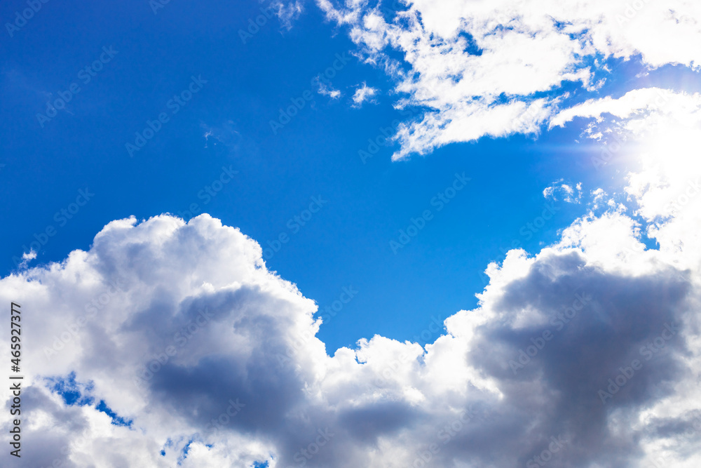 large cloud covers the sun and blue sky Stock Photo | Adobe Stock