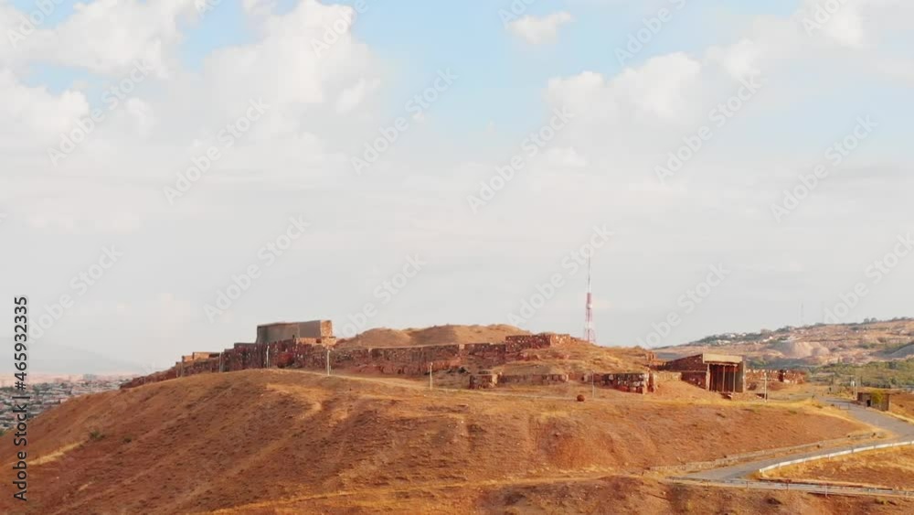 Revealing side aerial view old erebuni fortress building ruins and wall ...