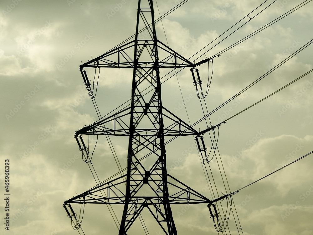 A Silhouette of a transmission tower, electricity pylon which is a tall ...