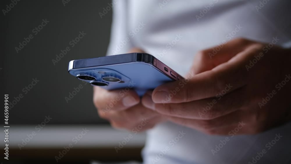 Typing message on Iphone 13 Pro mobile phone. Man types text in ...