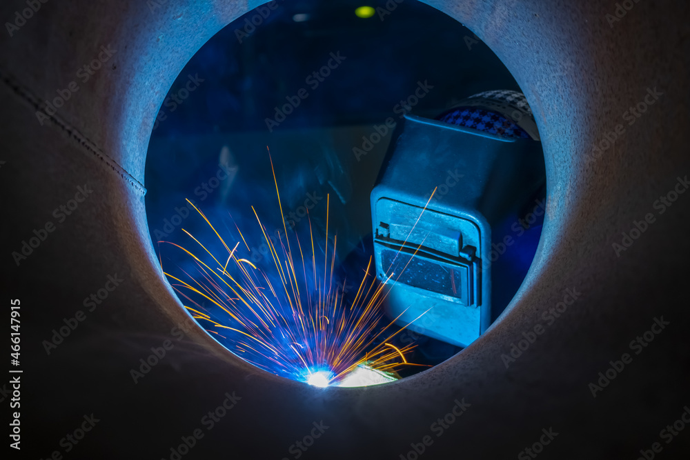Welding inside the pipe. Semi-automatic arc welding, MIG welding. Stock ...