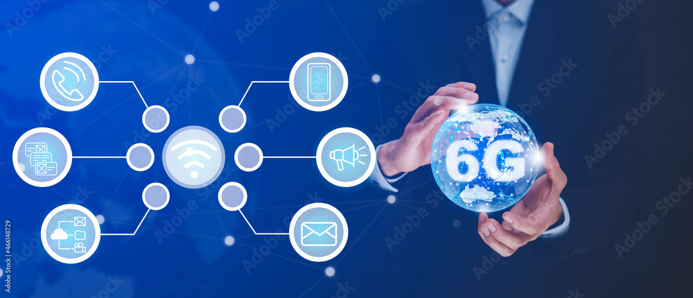 Businessman handhold ing with the world of 6G with icon concept ...