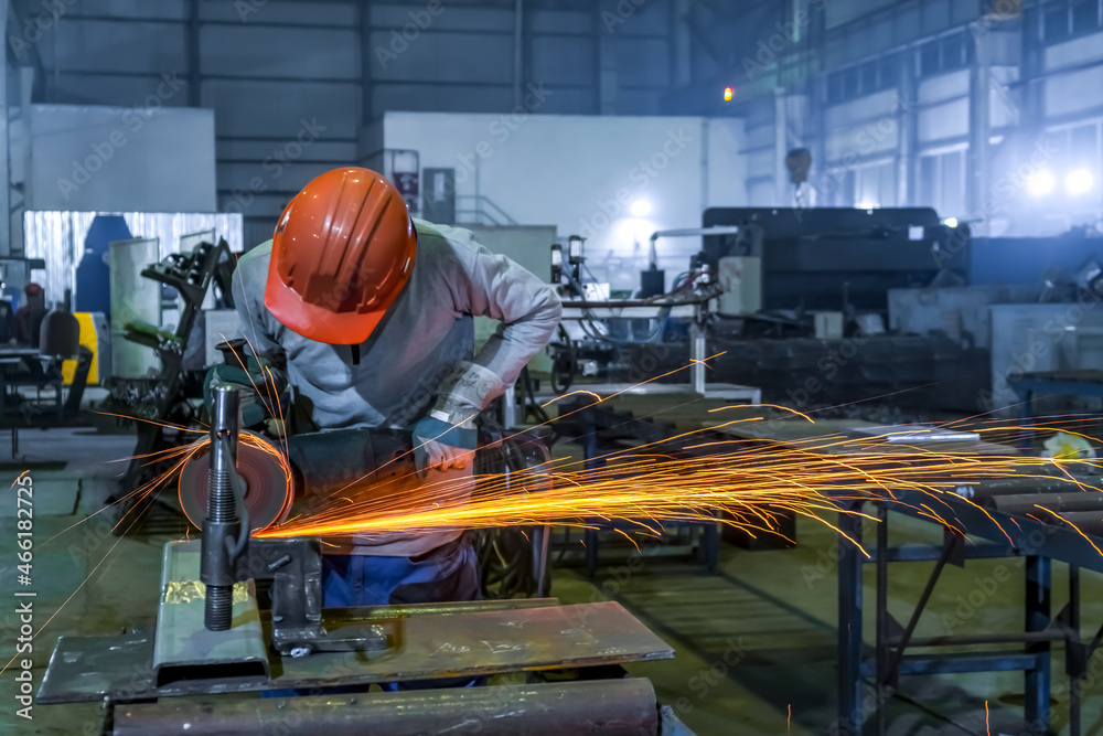 Rotation of the angle grinder disc during operation. Bright sparks from ...