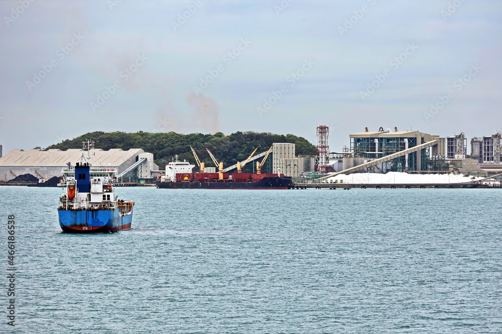 Vessels, bulk carrier and tugboats at the port under cargo operations ...