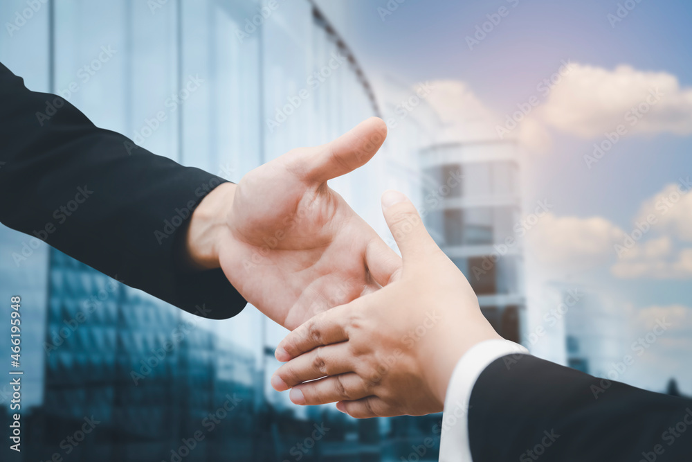 Double exposure of business Partner handshake between a man and a woman ...