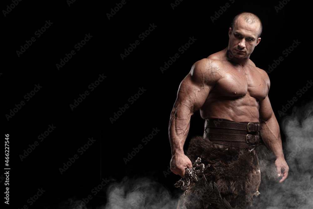 Ferocious muscular ancient warrior barbarian with fantasy sword on ...