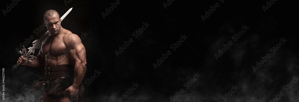 Ferocious muscular ancient warrior barbarian with fantasy sword on ...