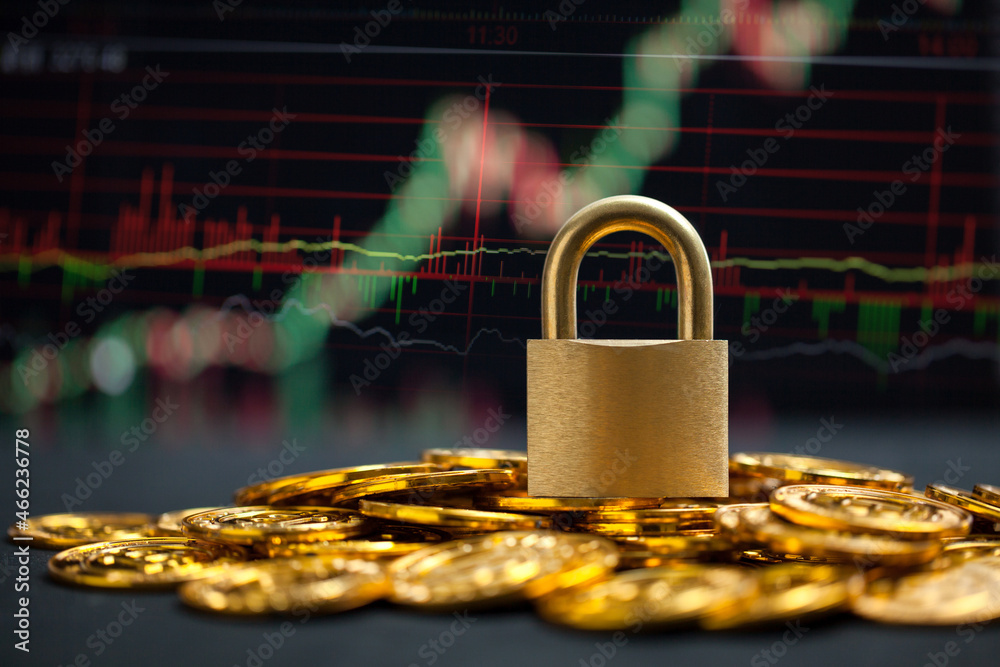 gold coin money and lock with financial chart on black background ...