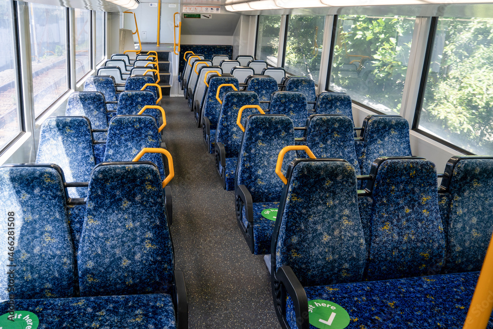 Sydney train carriage with stickers sit here on seats for social ...