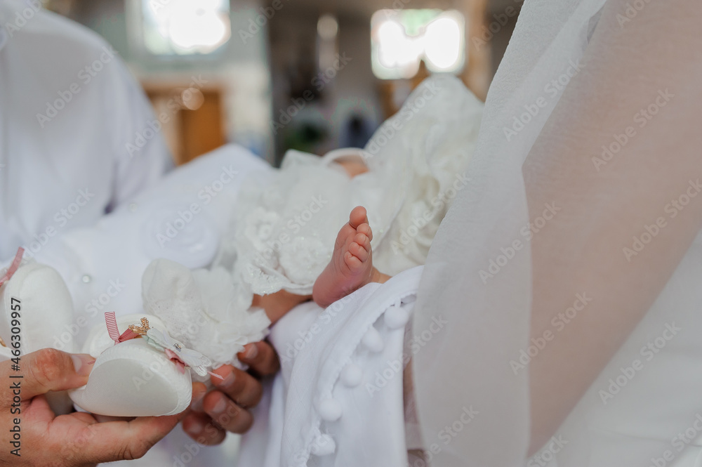 sacrament of baptism the priest baptizes the child with the anointing ...
