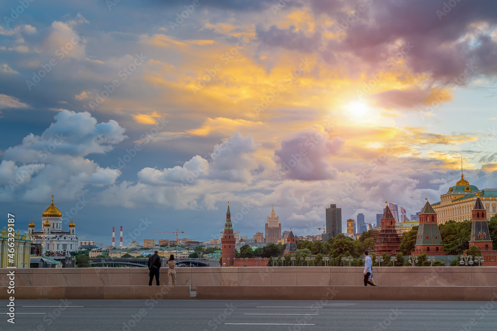 Colorful sunset over Moscow. The bright sun breaks through picturesque ...