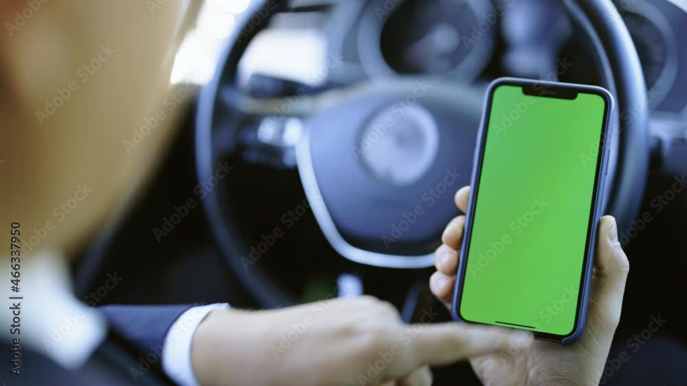 Back view of male hand touching, sliding on chroma key green screen ...