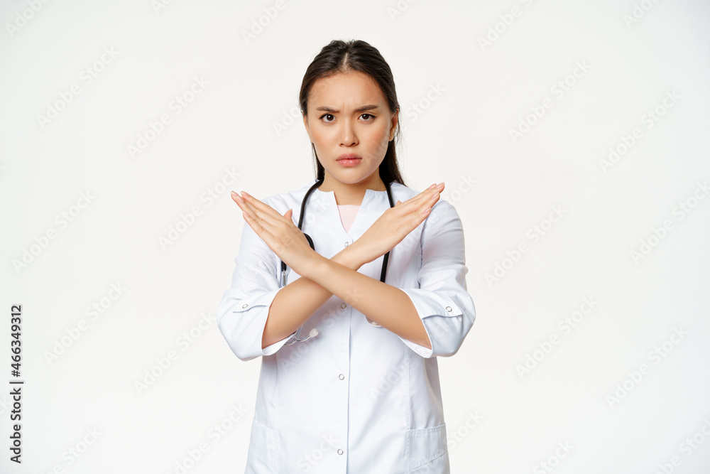 Serious asian woman doctor prohibit patient behaviour, showing stop ...