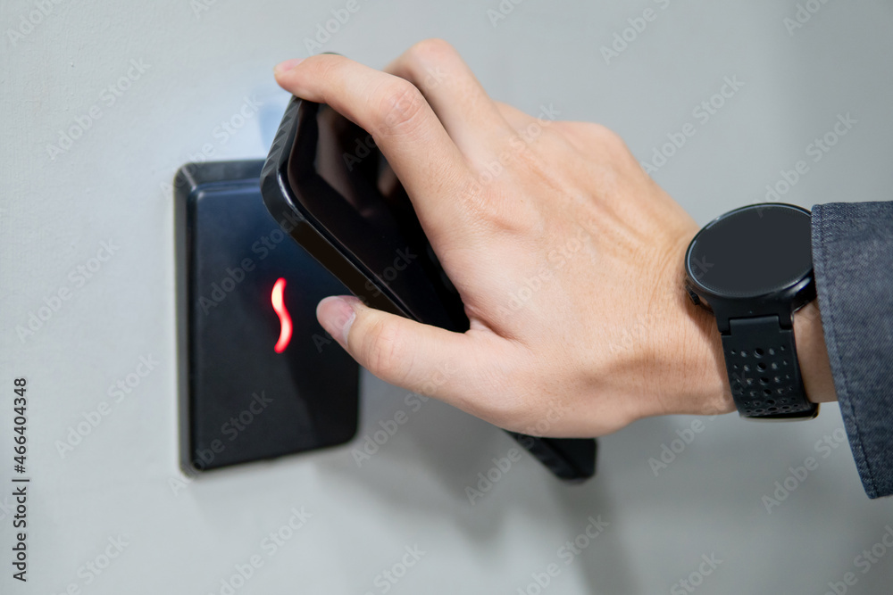 Male hand using smartphone for sensor scanning. Infrared sensor ...