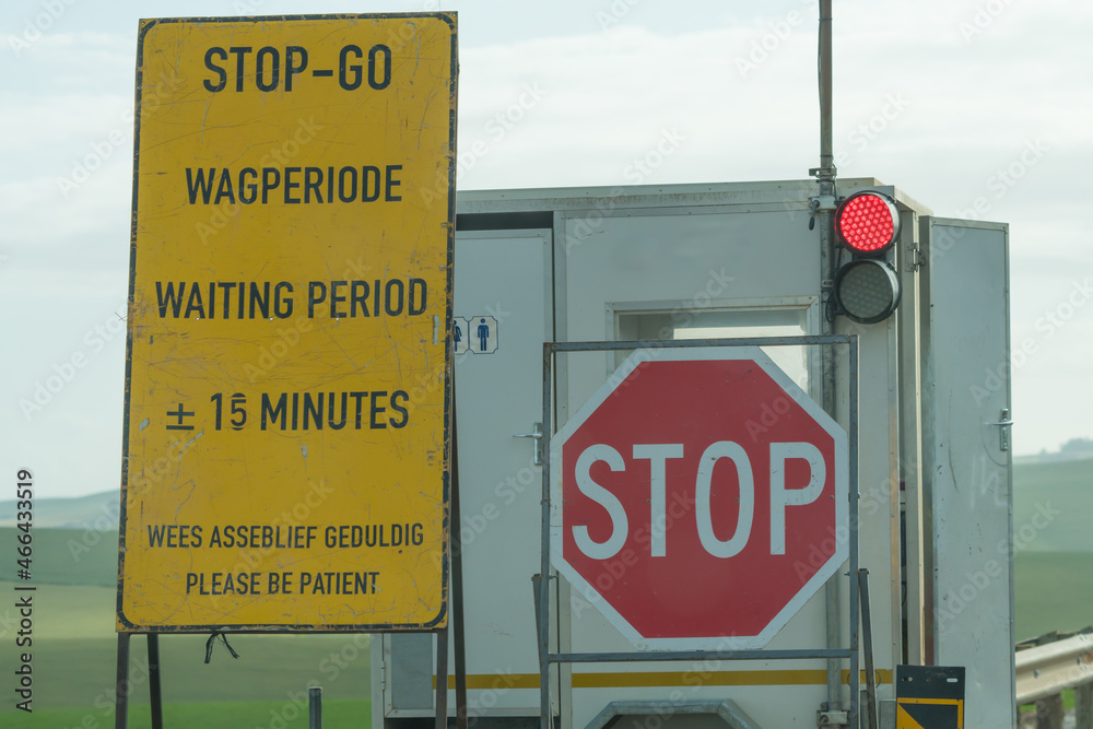 Stop Go road signs and red traffic light indicating roadworks in South ...