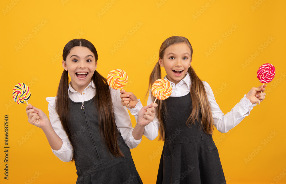 amazed teen girl in school uniform hold lollipop sweets, childhood ...