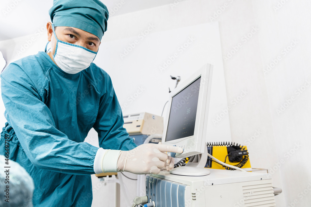 assistant surgeon put the patient on a ventilator-oxygen mask in ...