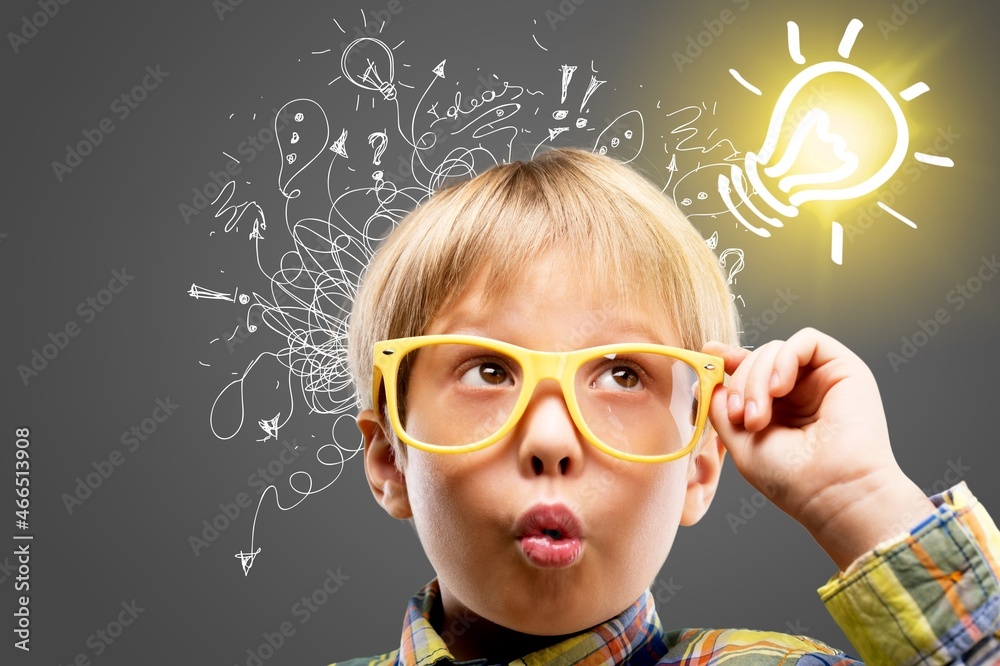 Thinking child boy with light bulb and question marks. Brainstorming ...