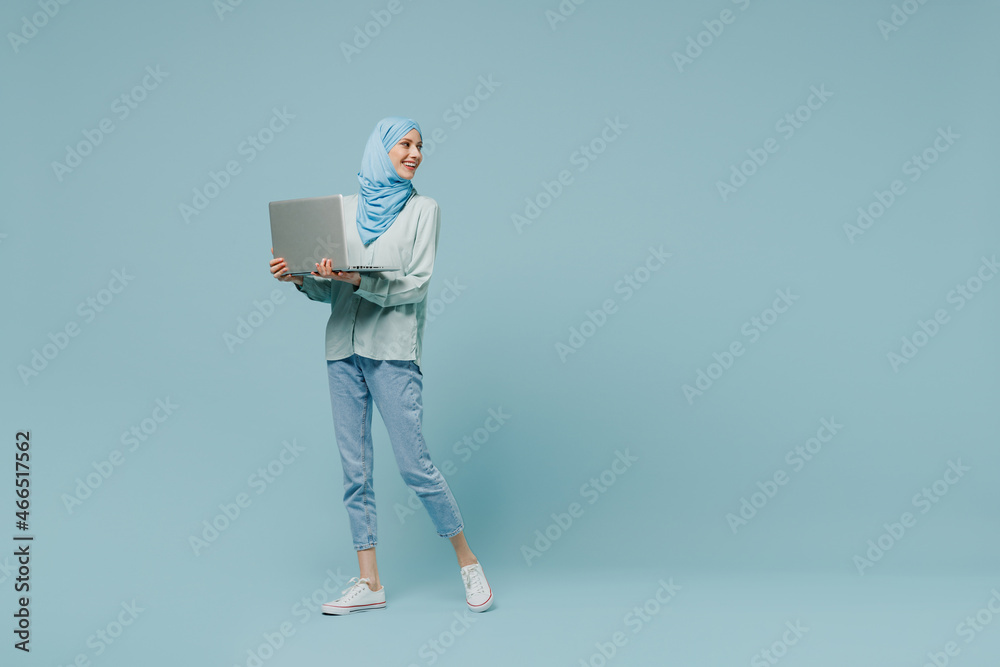 Full body young arabian asian muslim woman in abaya hijab hold use work ...