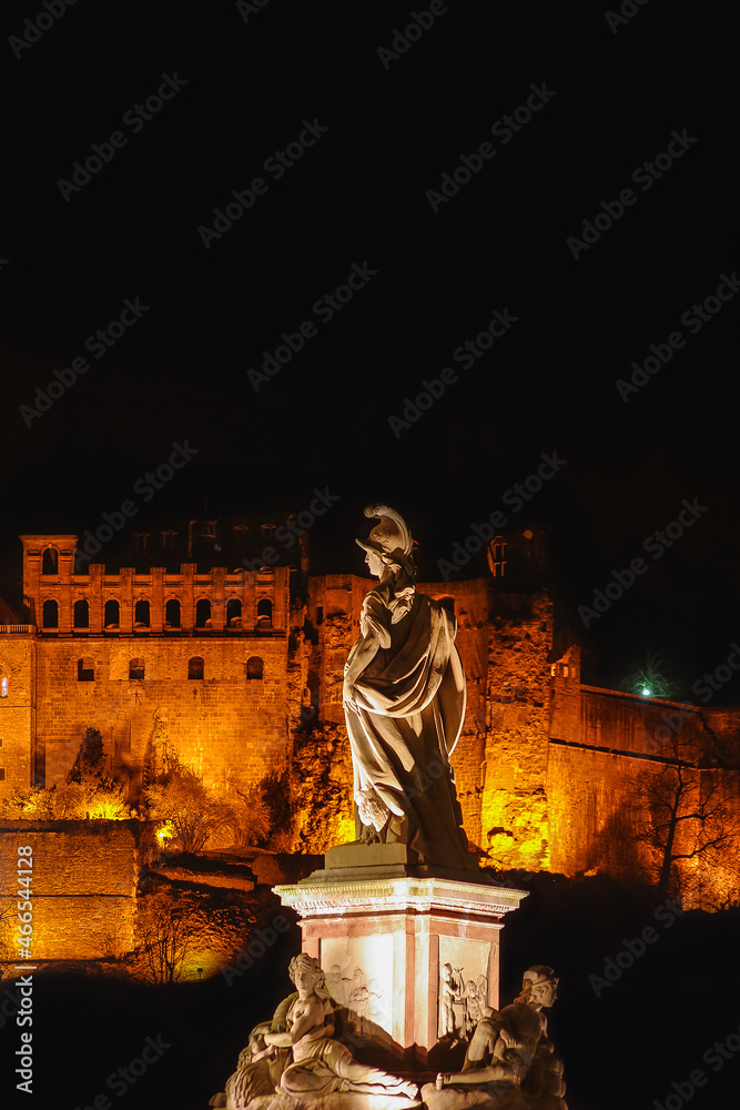 Cover page with night view with illumination of an old statue of ...
