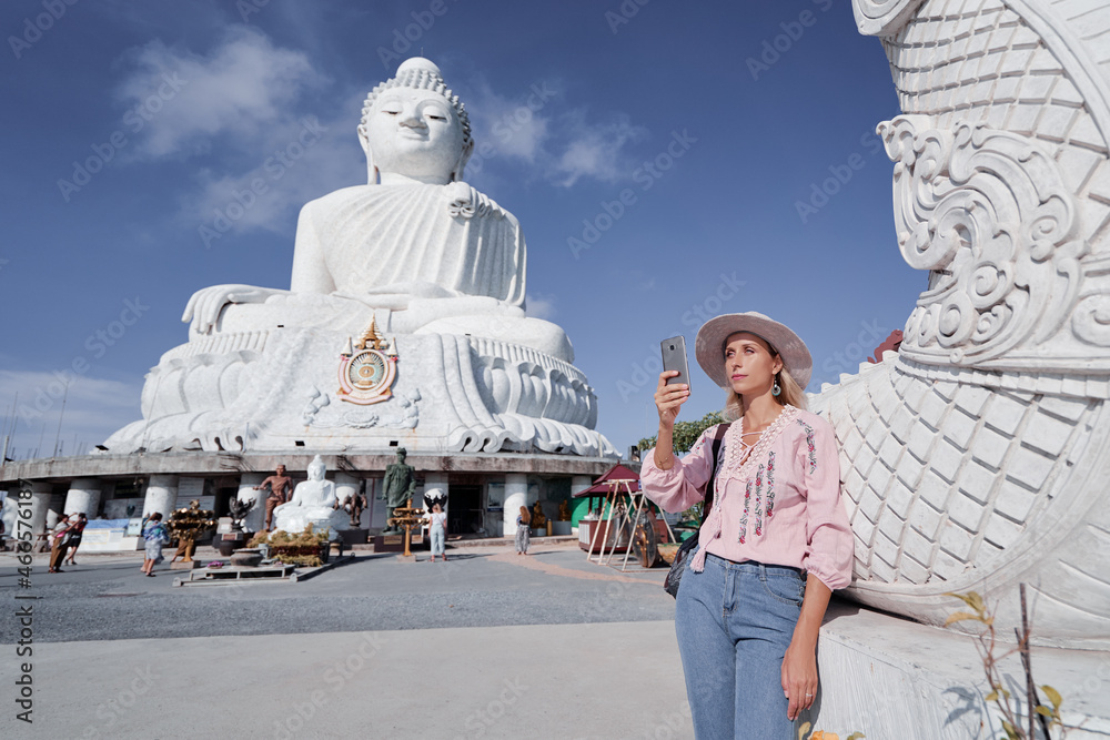 Traveling by Thailand. Pretty young woman in hat taking photo in the ...