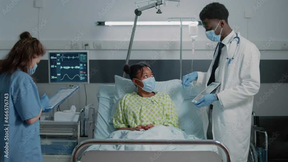 Physician pointing at tablet with cardiology diagnosis to explain ...