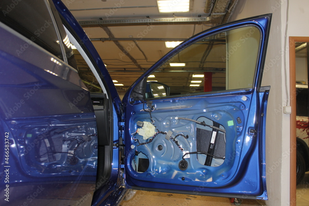 Car tuning. Disassembled car. Disassembled blue car door for ...