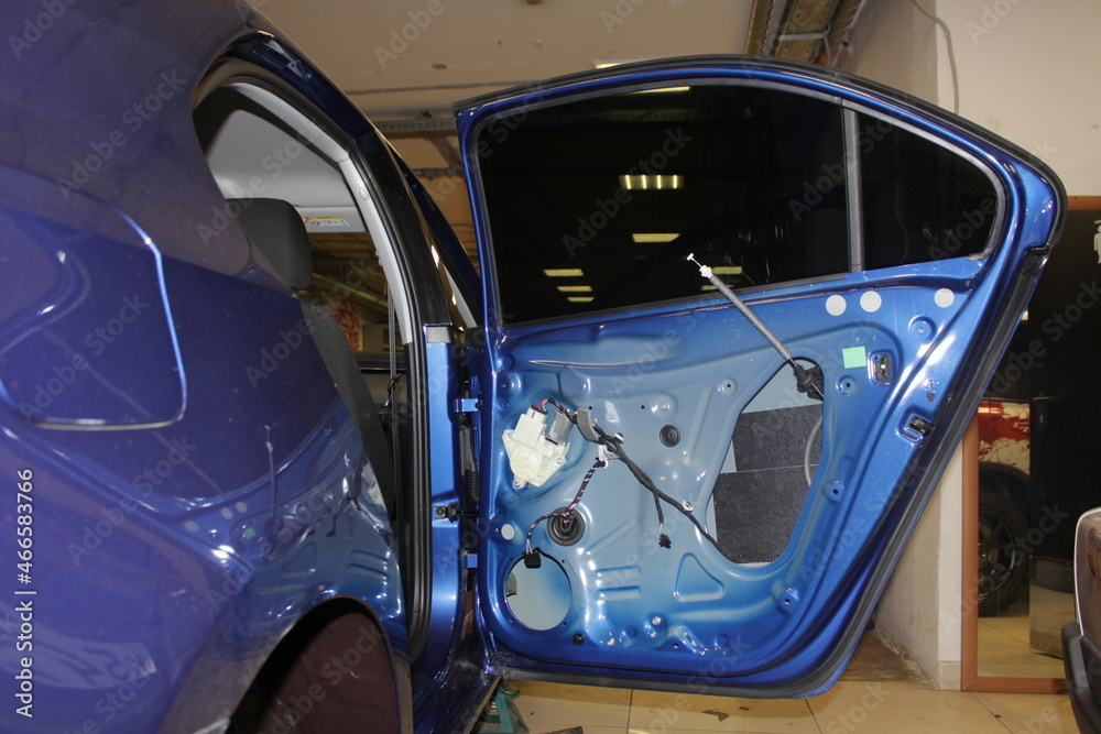 Car tuning. Disassembled car. Disassembled blue car door for ...