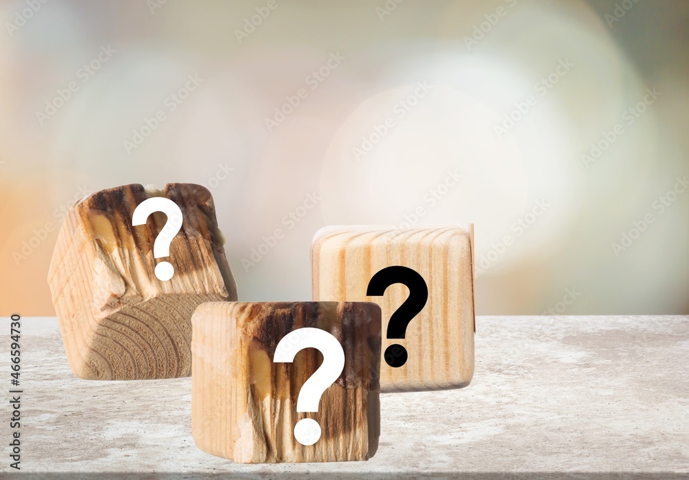 Cube with question mark on wooden desk Stock Photo | Adobe Stock