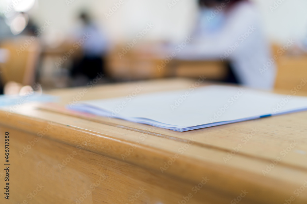 Document paper sheet exam on desk at school in Exam testroom, Blurred ...