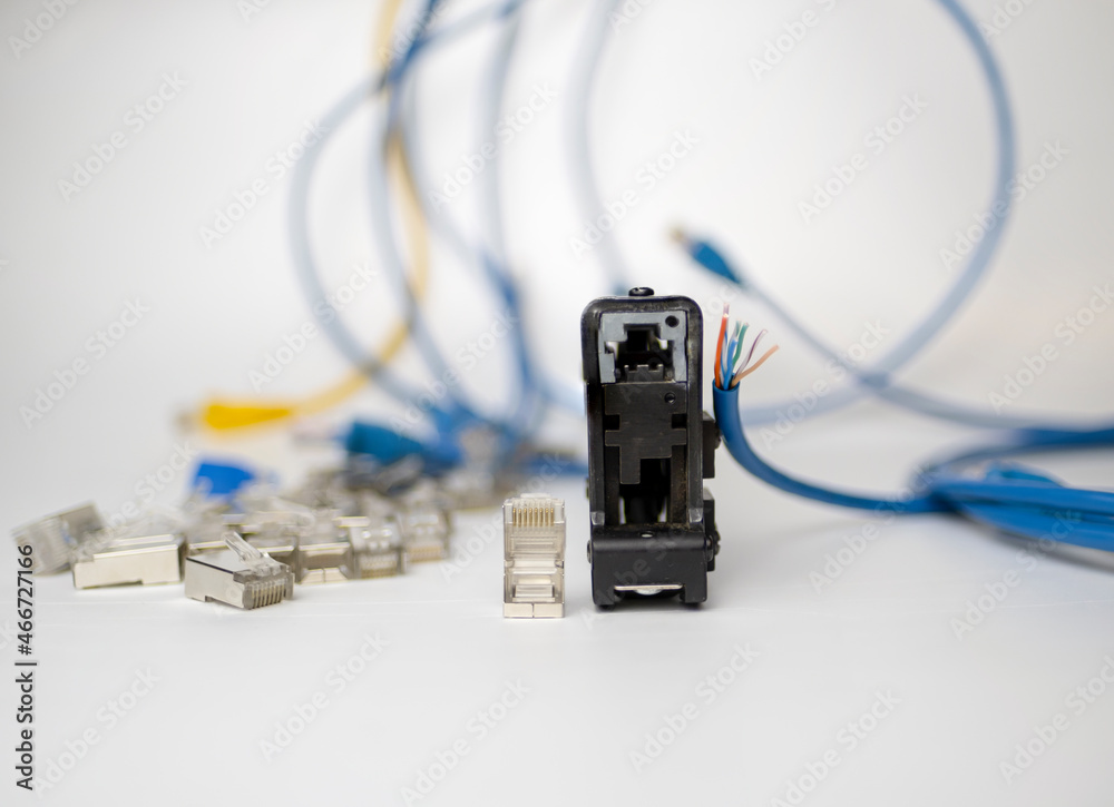 Abstract background with a tool for crimping an Internet cable, with ...