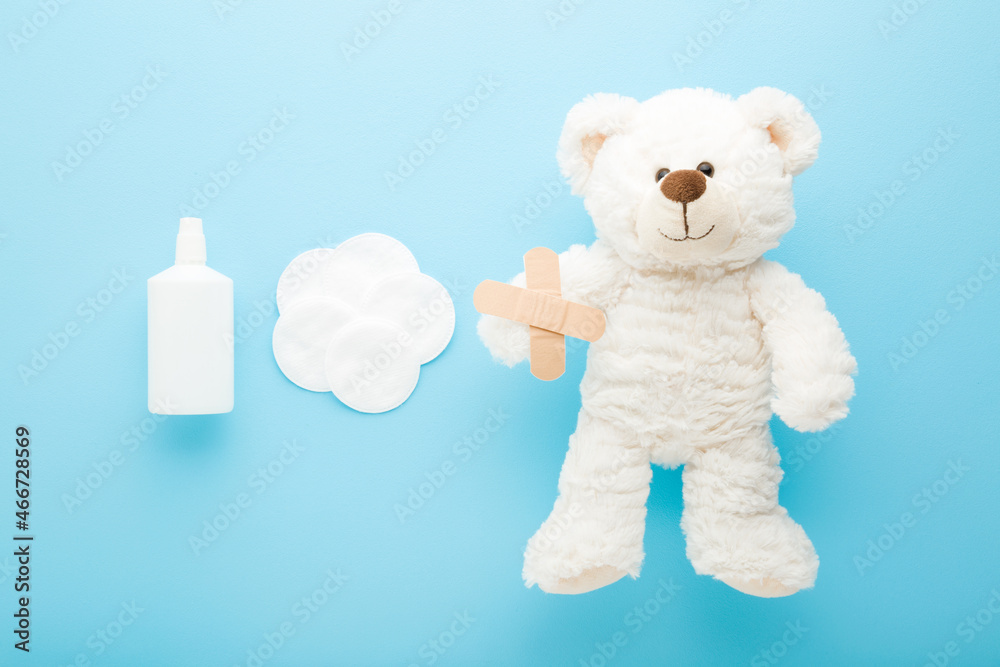 White bottle of hydrogen peroxide, cleansing cotton pads, adhesive ...