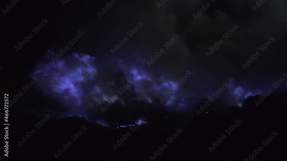 Blue fire of burning sulfur in a crater of a volcano Kawah ijen, Java ...