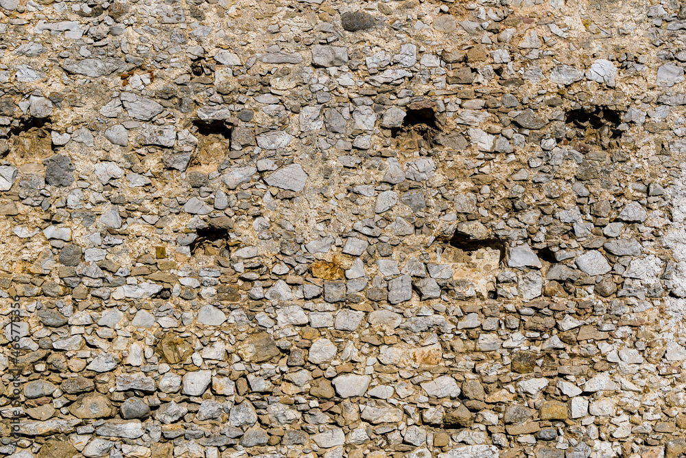 Medieval wall with holes on wooden beams that fell out of time Stock ...