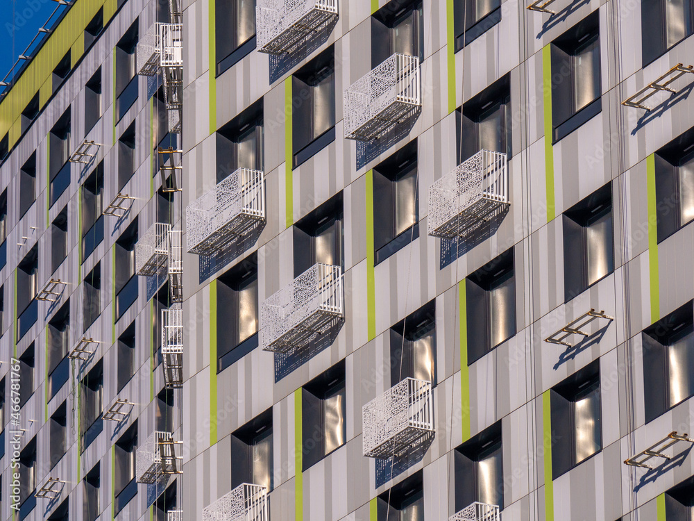 The facade of a new high-rise building with windows and compartments ...