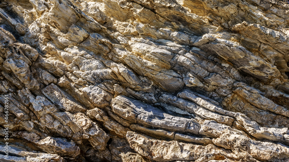 Detail of a rock with variants of blue. Rock full of curves and smooth ...