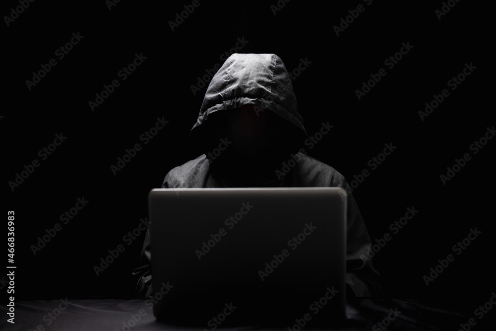 Hackers wear hoods to cover their faces. Hacking to steal important ...